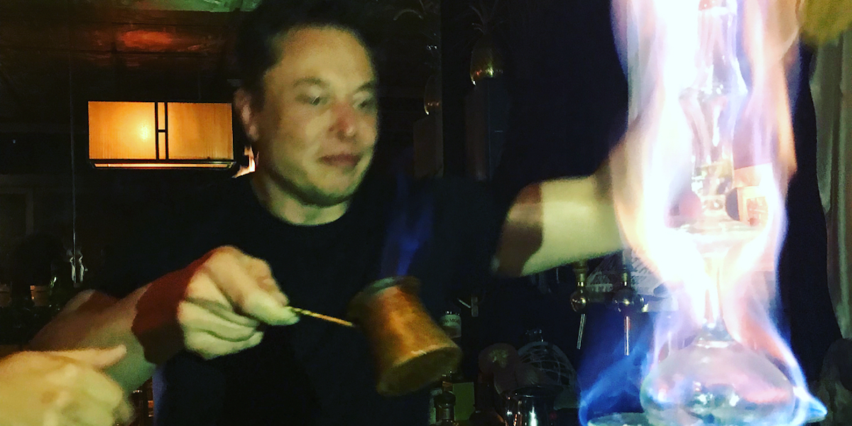 Watch Elon Musk Pour Flaming Absinthe Over Tower of Glasses | Inverse